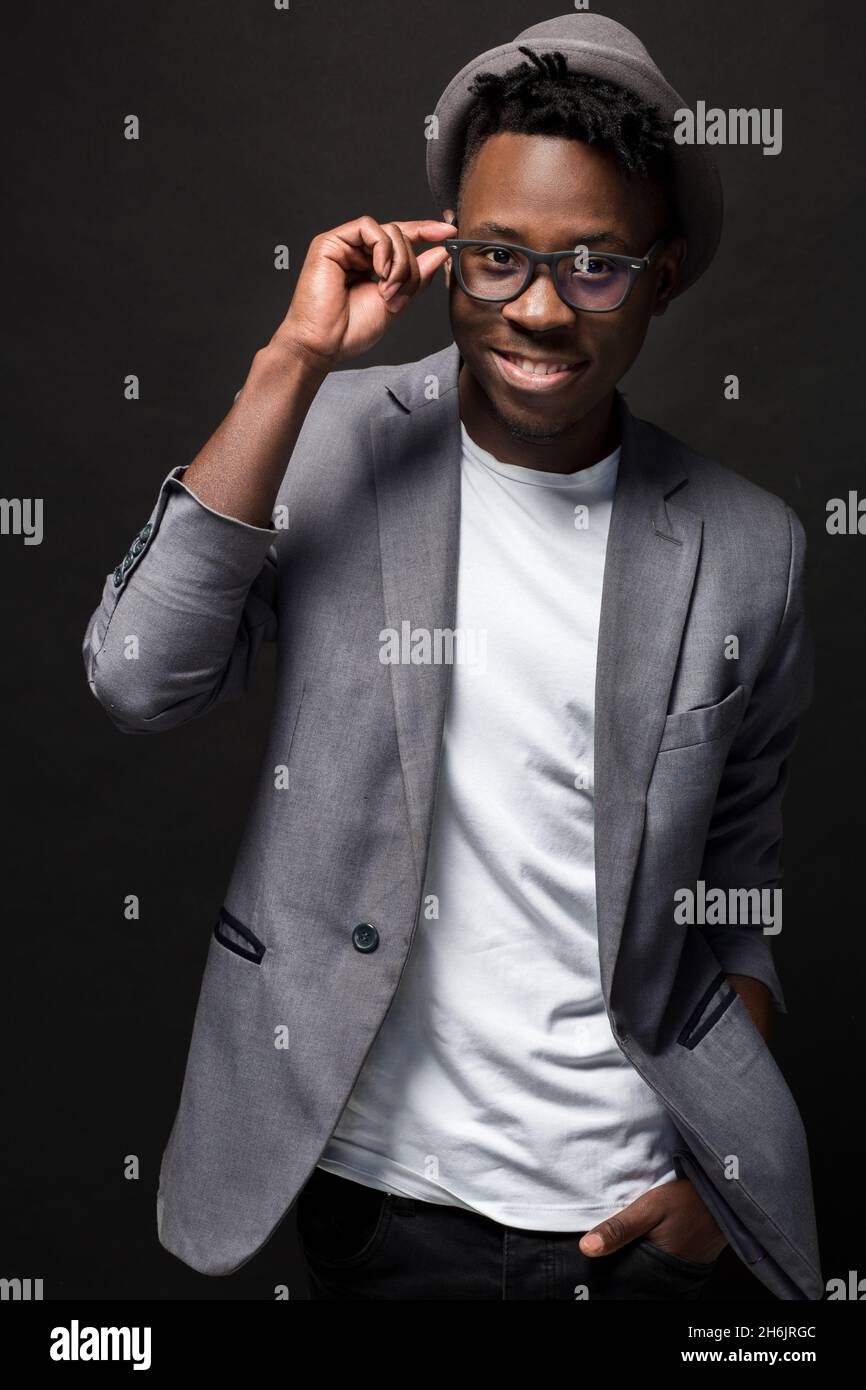 Close-up portrait of handsome black man with charming smile. Studio ...