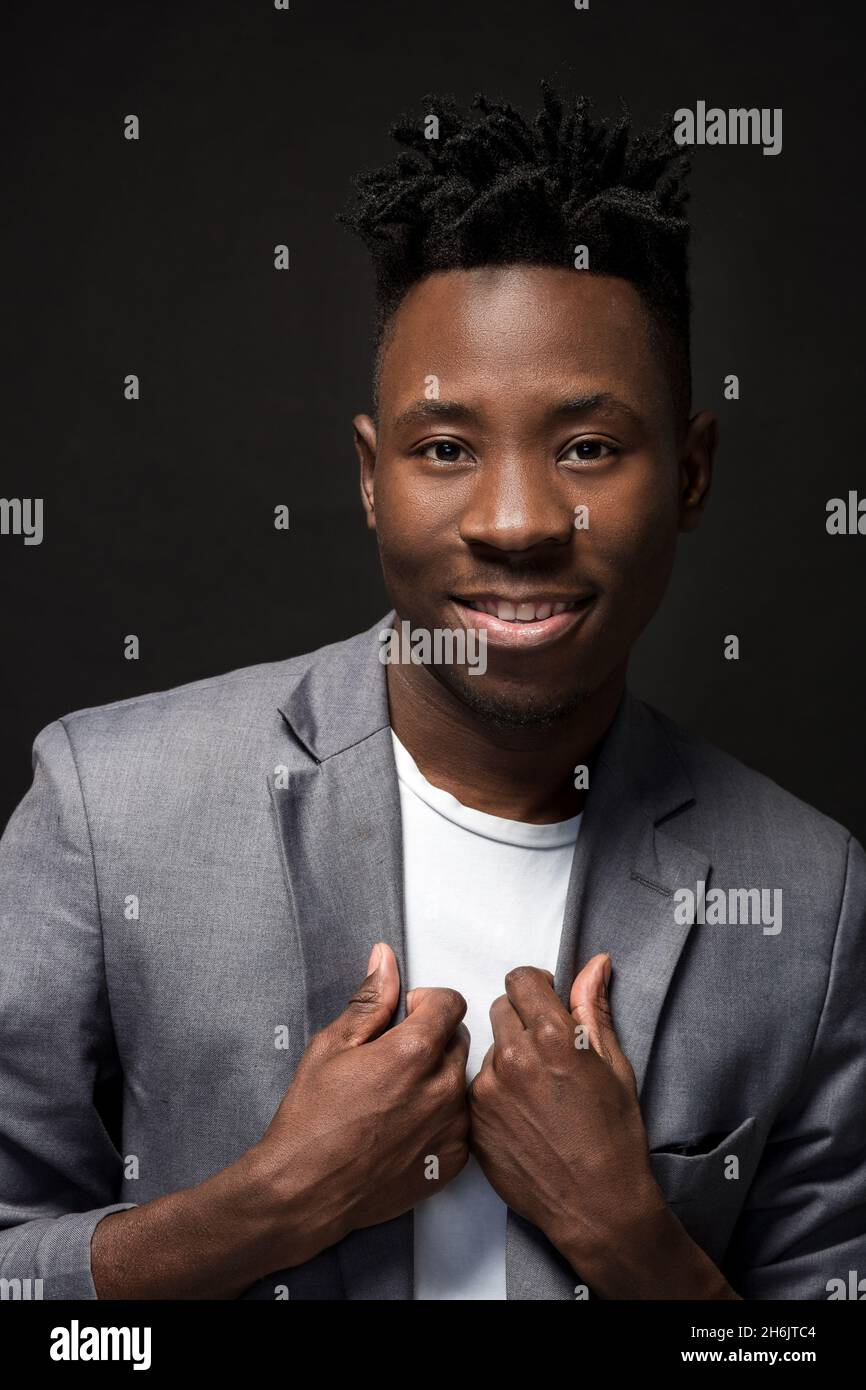 Close-up portrait of handsome black man with charming smile. Studio ...
