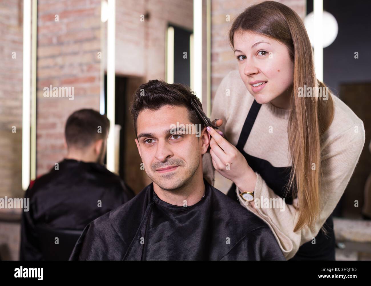 Male getting haircut by professional hairdresser Stock Photo - Alamy
