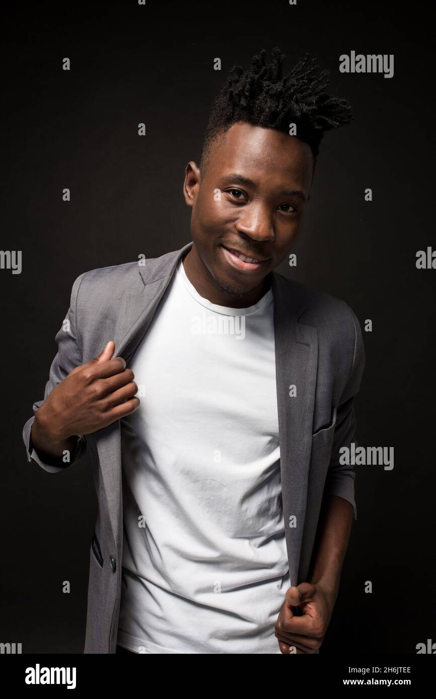 Close-up portrait of handsome black man with charming smile. Studio ...