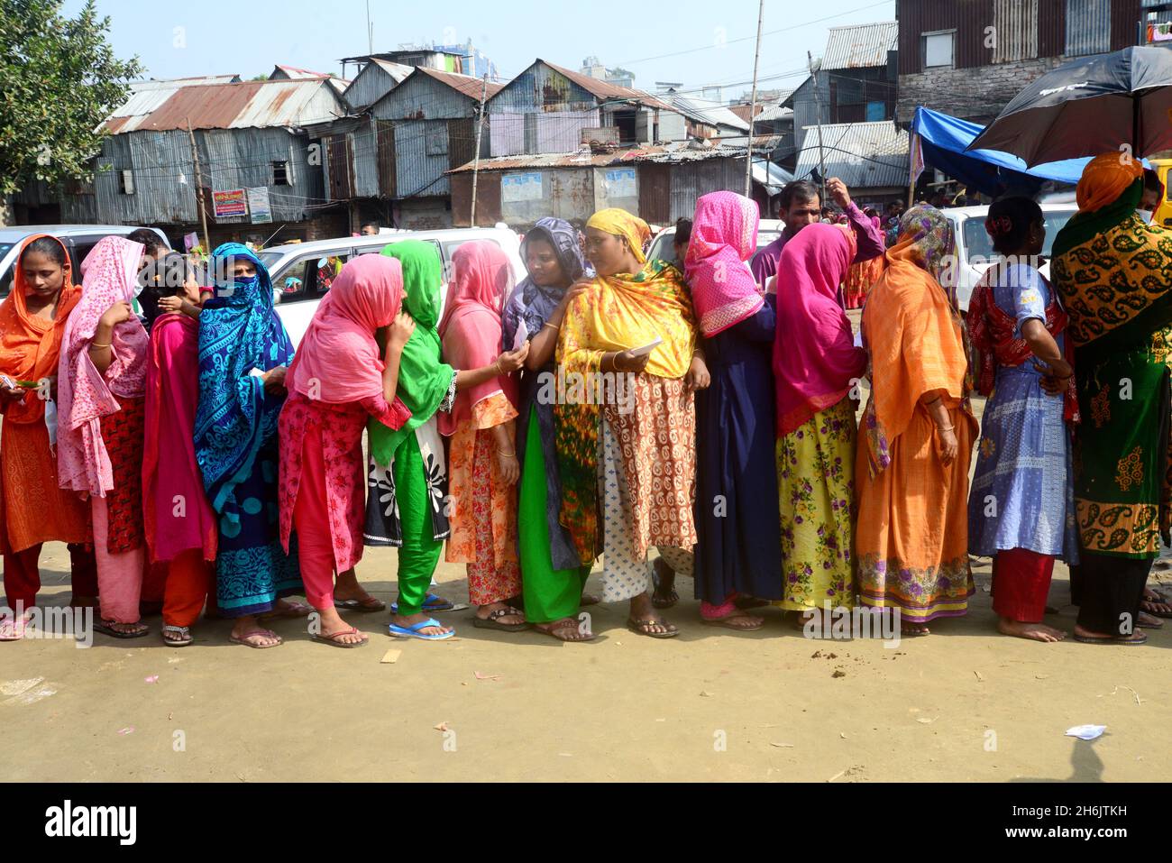 Slum women waits in a line for receive a dose of the AstraZeneca/Oxford ...