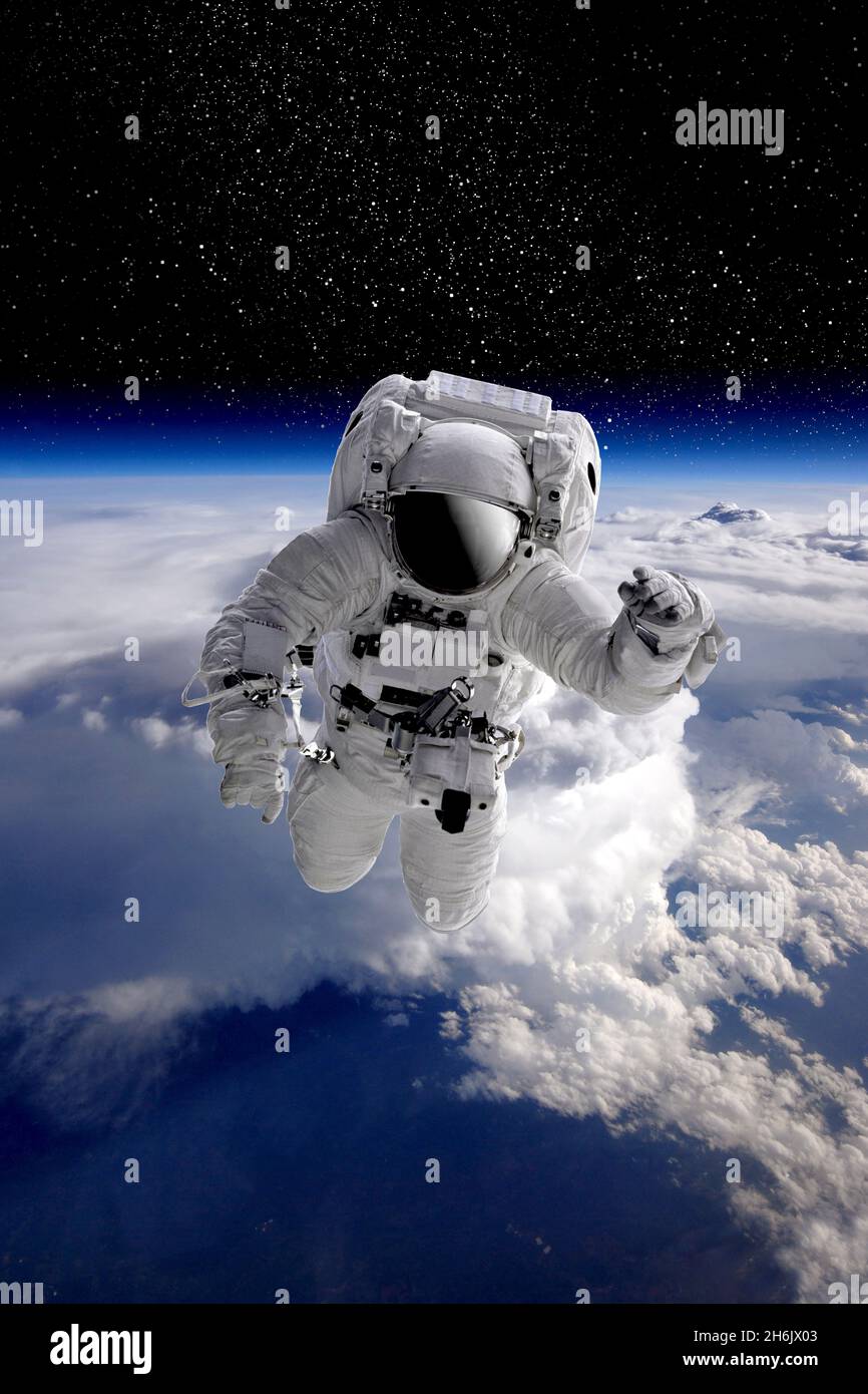 Astronaut in outer open space over the planet Earth.Stars provide the ...