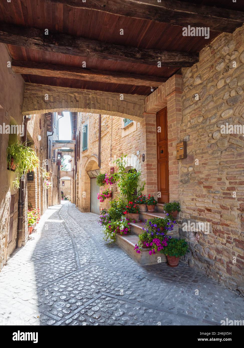 A typical colorful street in Montefalco's old town, Montefalco, Umbria ...
