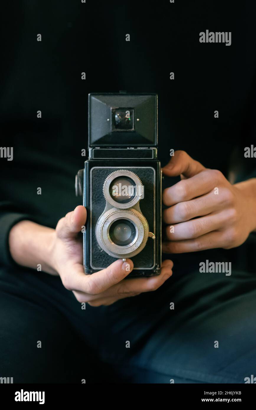 Holding old retro 35mm film camera hi-res stock photography and images ...
