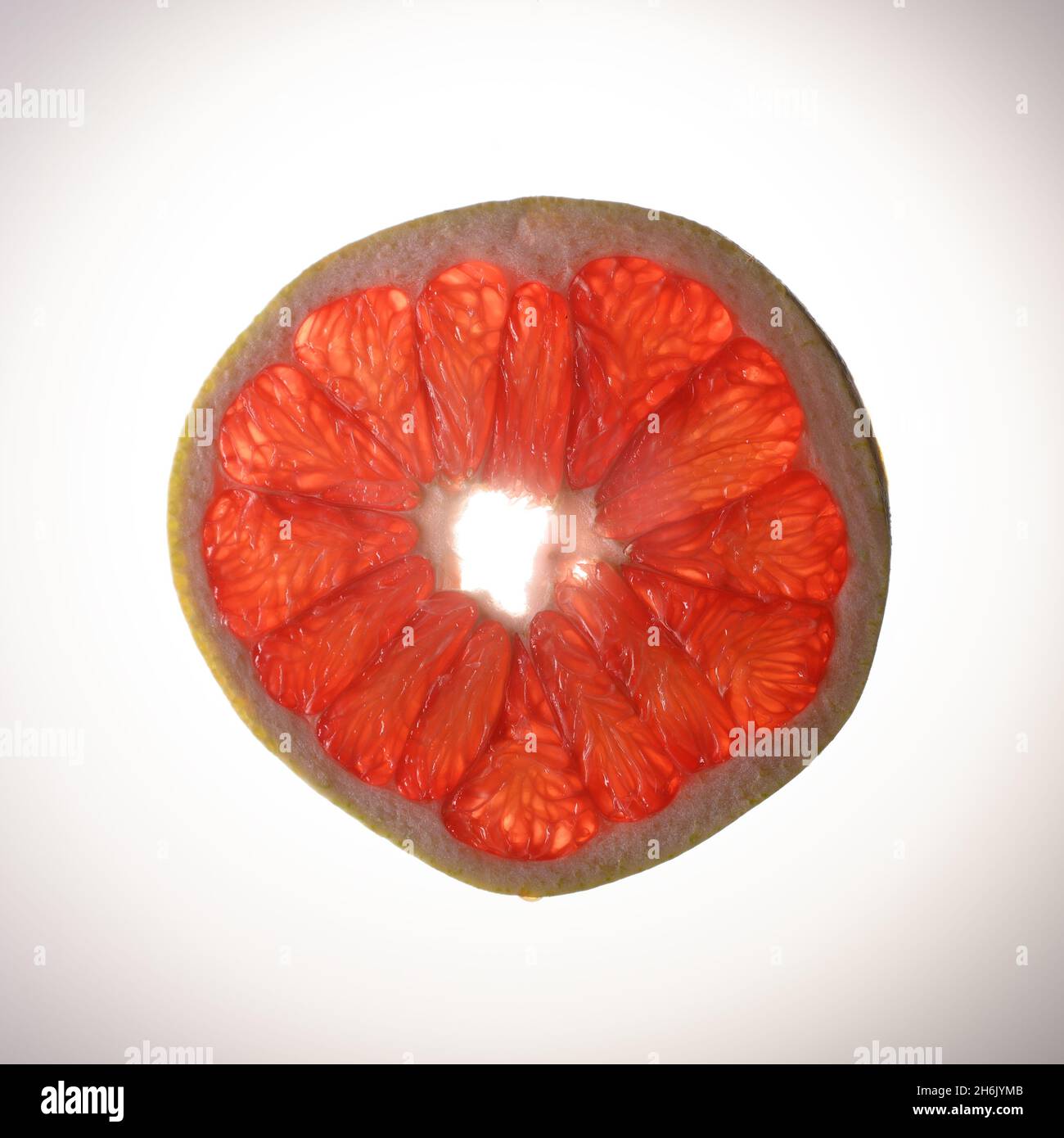 The photo shows a round piece, a pomelo slice. The inside of the exotic ...