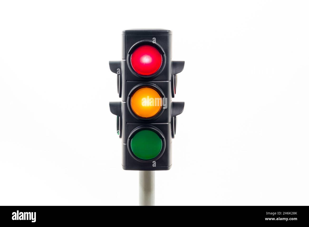 Traffic light showing red and amber lights isolated on a white ...