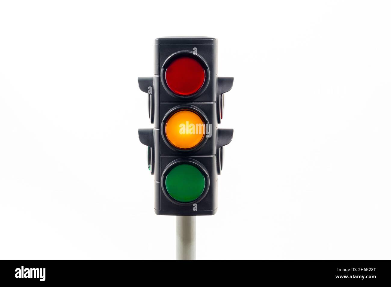 Amber traffic light isolated on a white background Stock Photo - Alamy