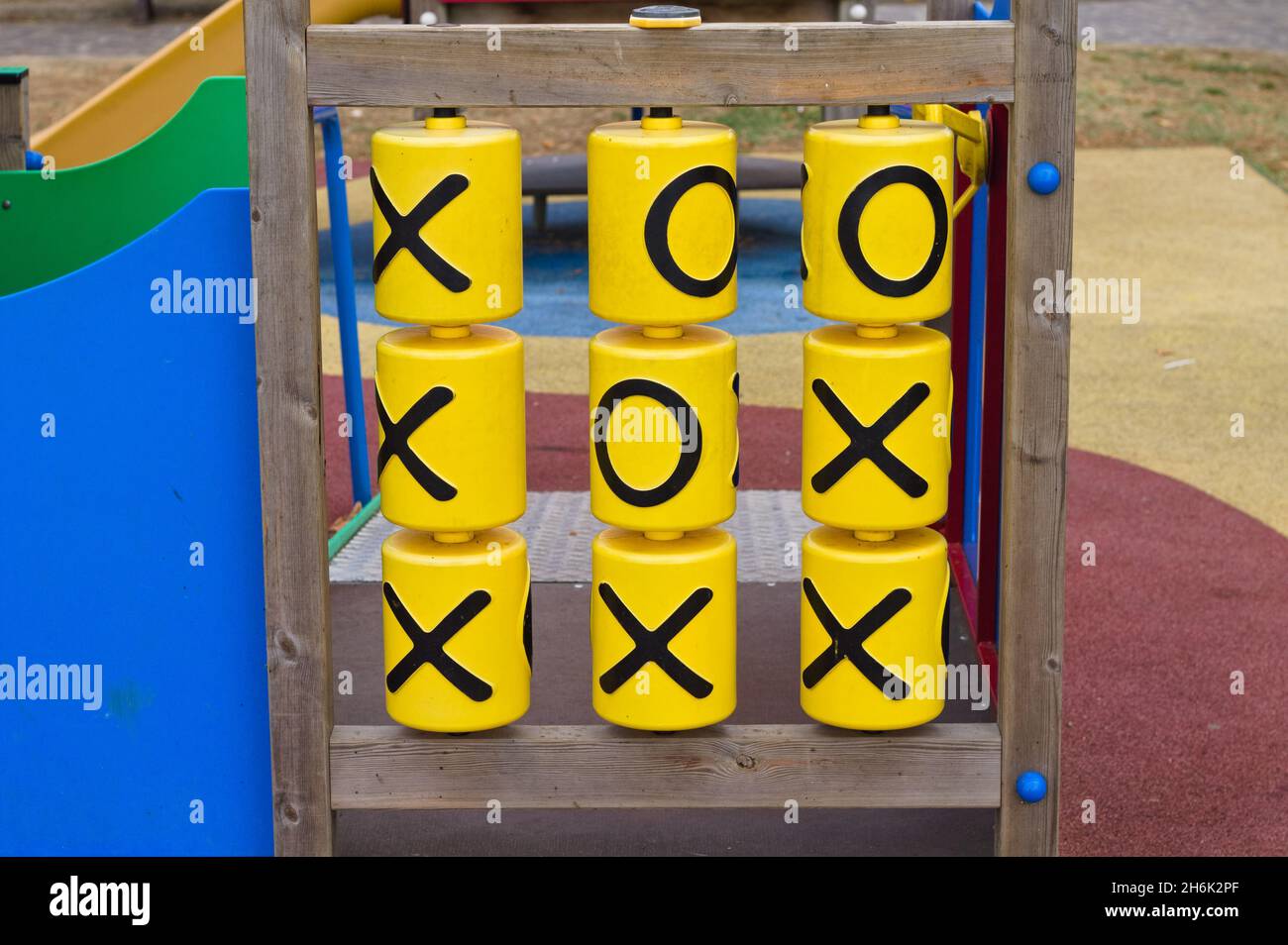 A plastic and wooden tic-tac-toe game in a children's playground in a ...