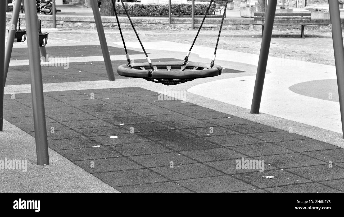 A swing on a children's playground in a public park (Umbria, Italy ...