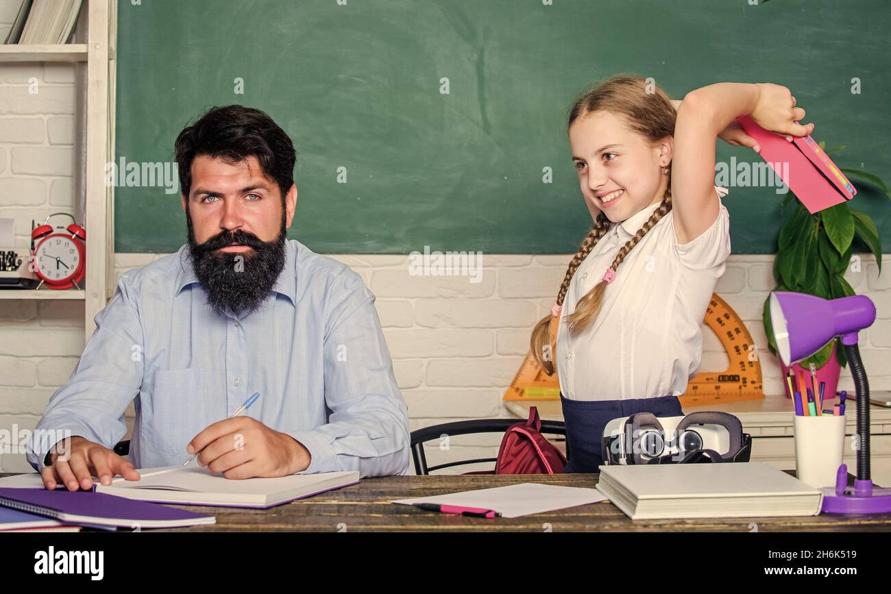 Study is fun. School teacher and schoolgirl. Homeschooling with father ...
