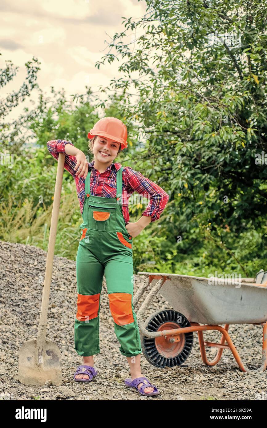 future engineer. happy kid use construction wheelbarrow. building ...