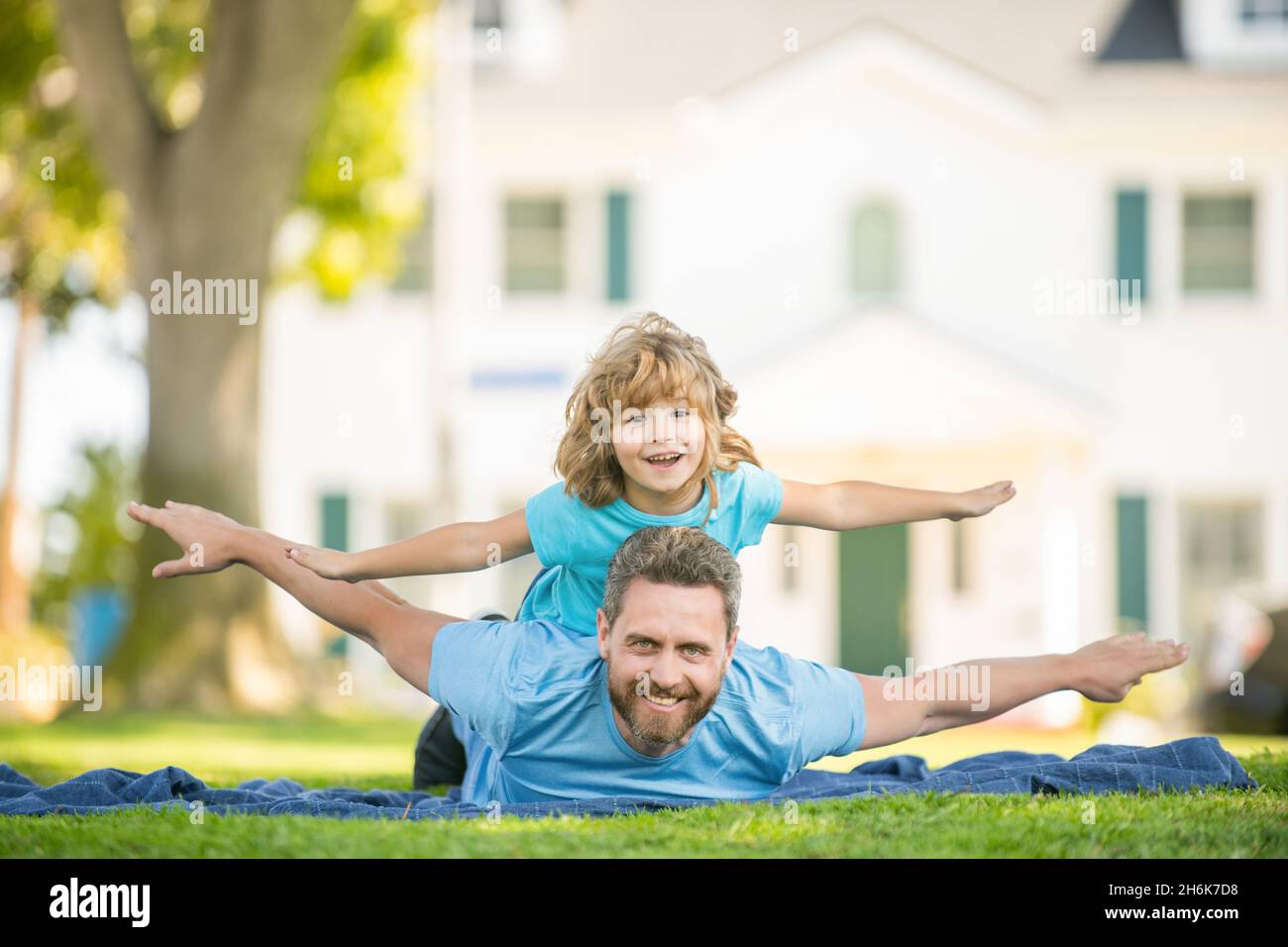 happy father and son having fun in park. family value. childhood and ...