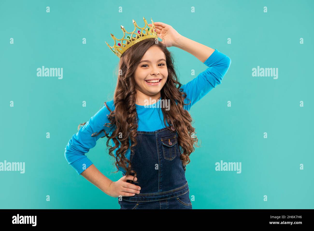 happy child in crown. self confident queen. expressing smug. arrogant ...
