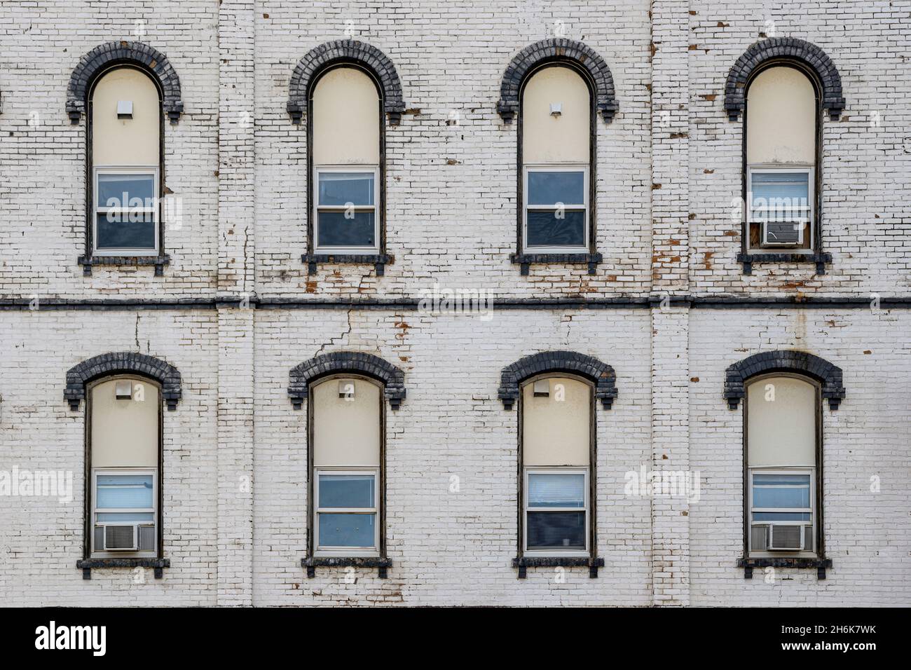 Eight windows against brick wall of abandoned building in historic ...