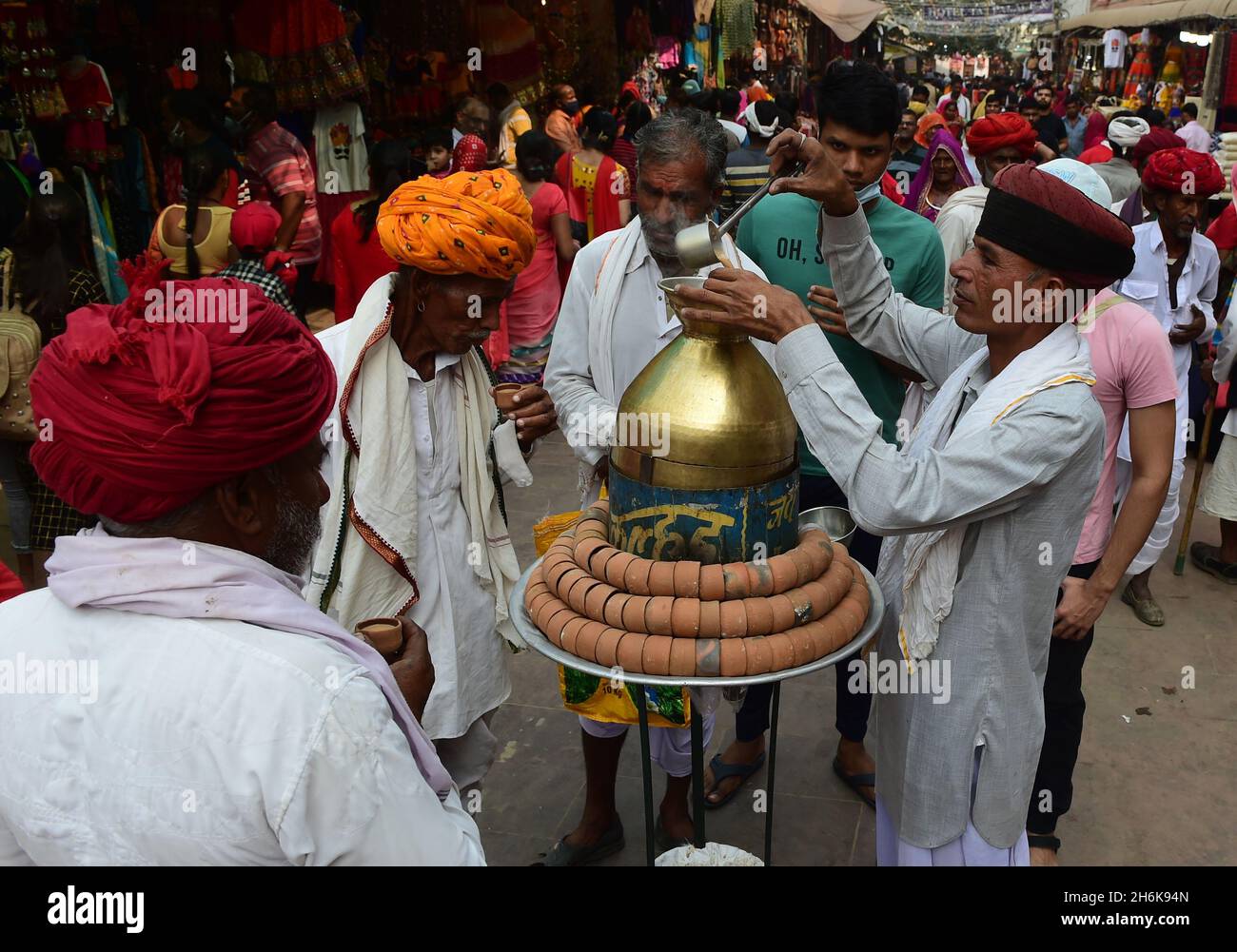 Pushkar, India. 16th Nov, 2021. A Rajasthani tea maker serves tea in ...
