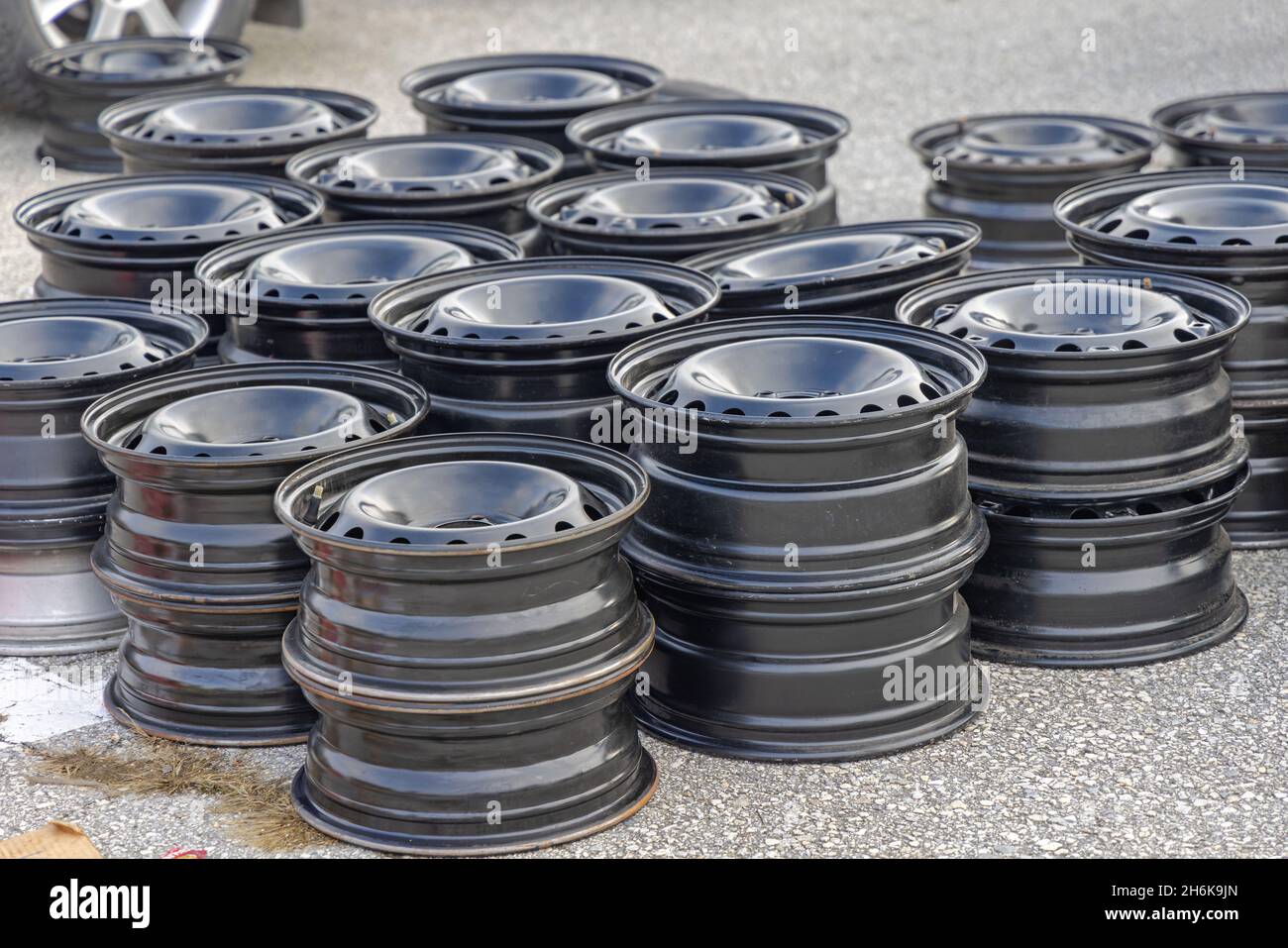 Many Black Steel Metal Wheels for Cars Stock Photo - Alamy