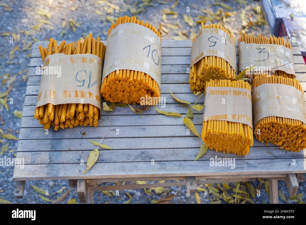 Yellow Wax Candlesticks for Sale at Street Stock Photo - Alamy