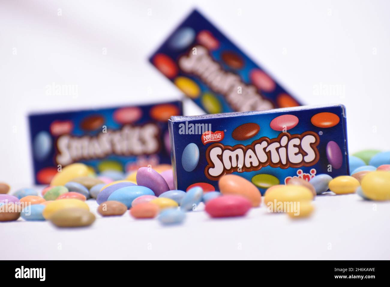 A box of colorful Smarties surrounded by candy, manufactured by Nestlé ...