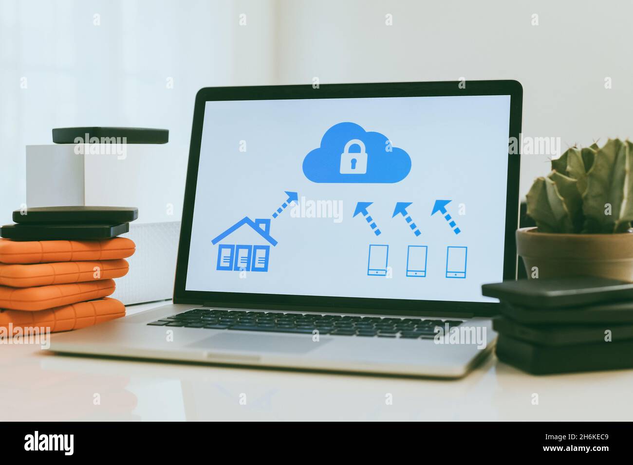 Laptop on the desk with network attached storage. Living room view ...