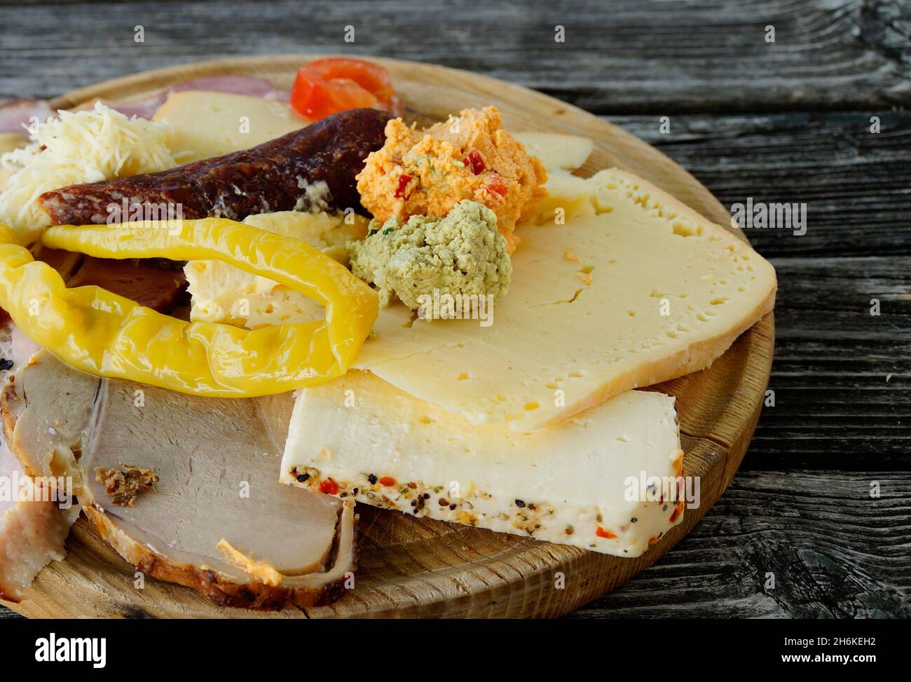 a rustic meal of cheeses and cold cuts in the Austrian Alps of the ...