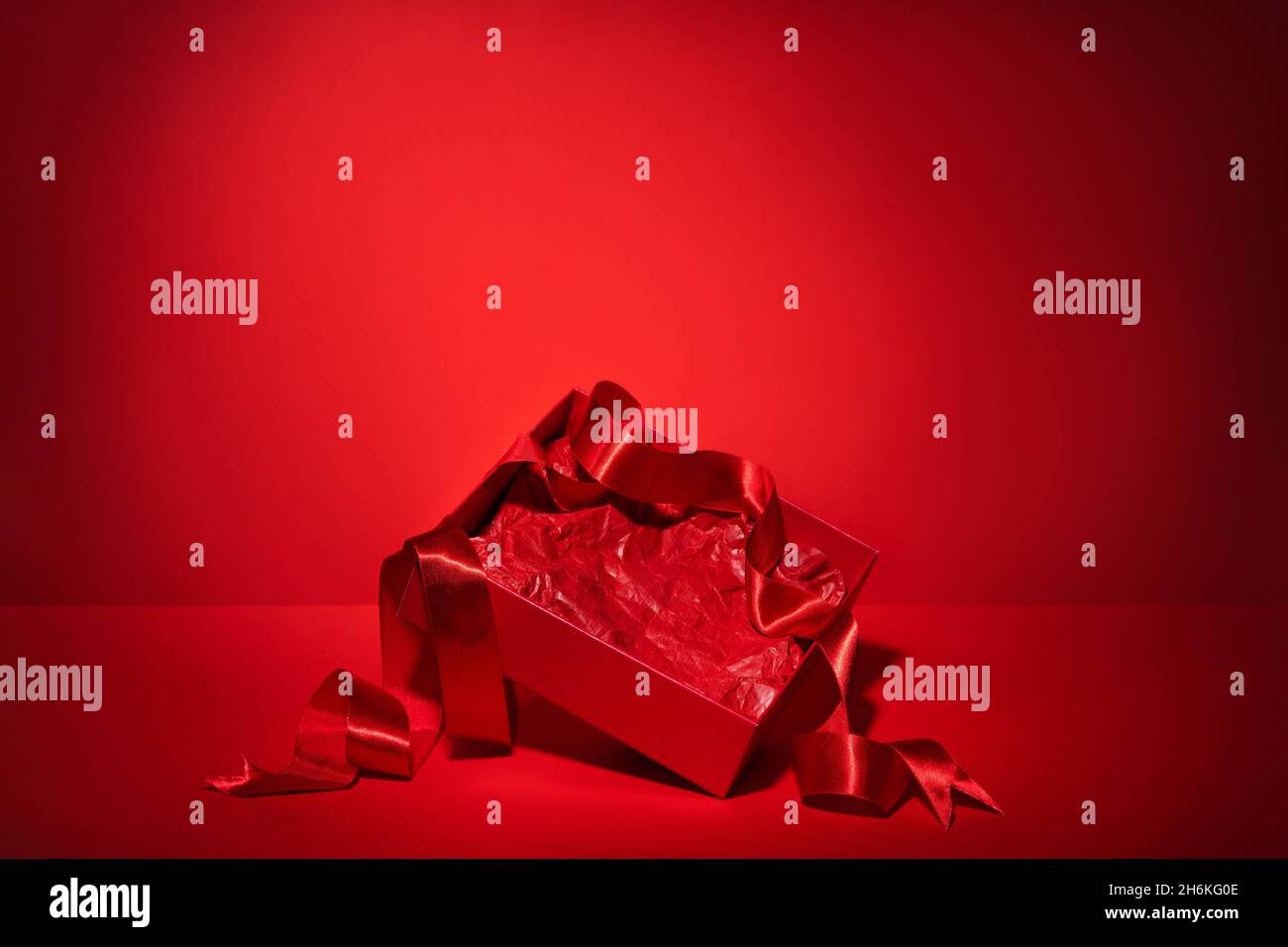 Blank open red holiday gift box with ribbon, mock up for advertisement ...