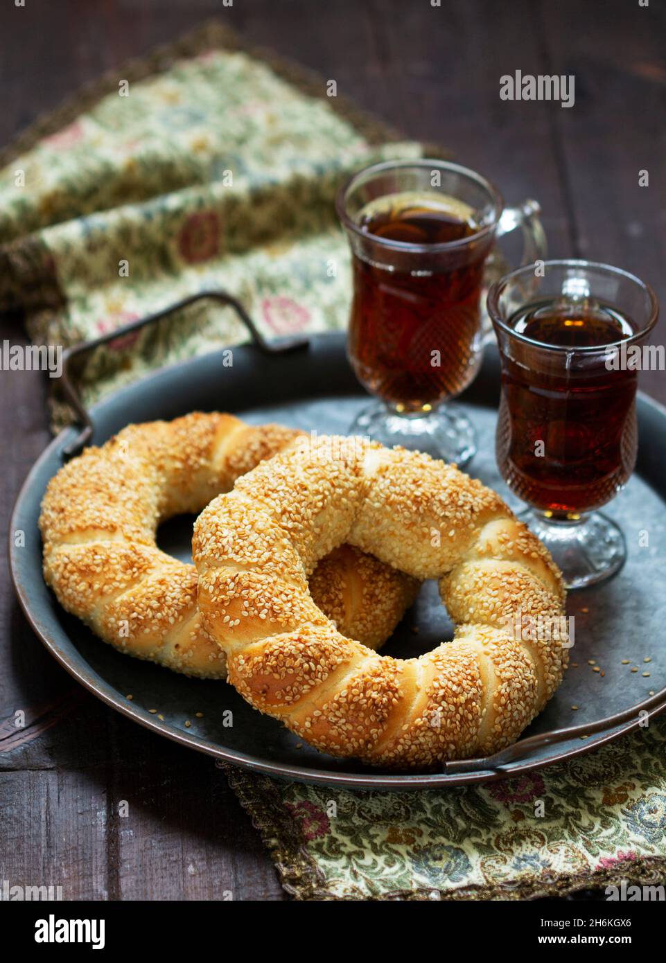 Traditional Turkish simits served with tea. Rustic style Stock Photo ...