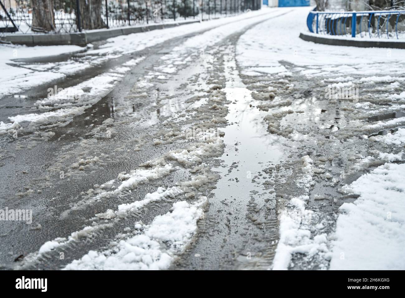 Slush on the road during winter snowfall Stock Photo - Alamy