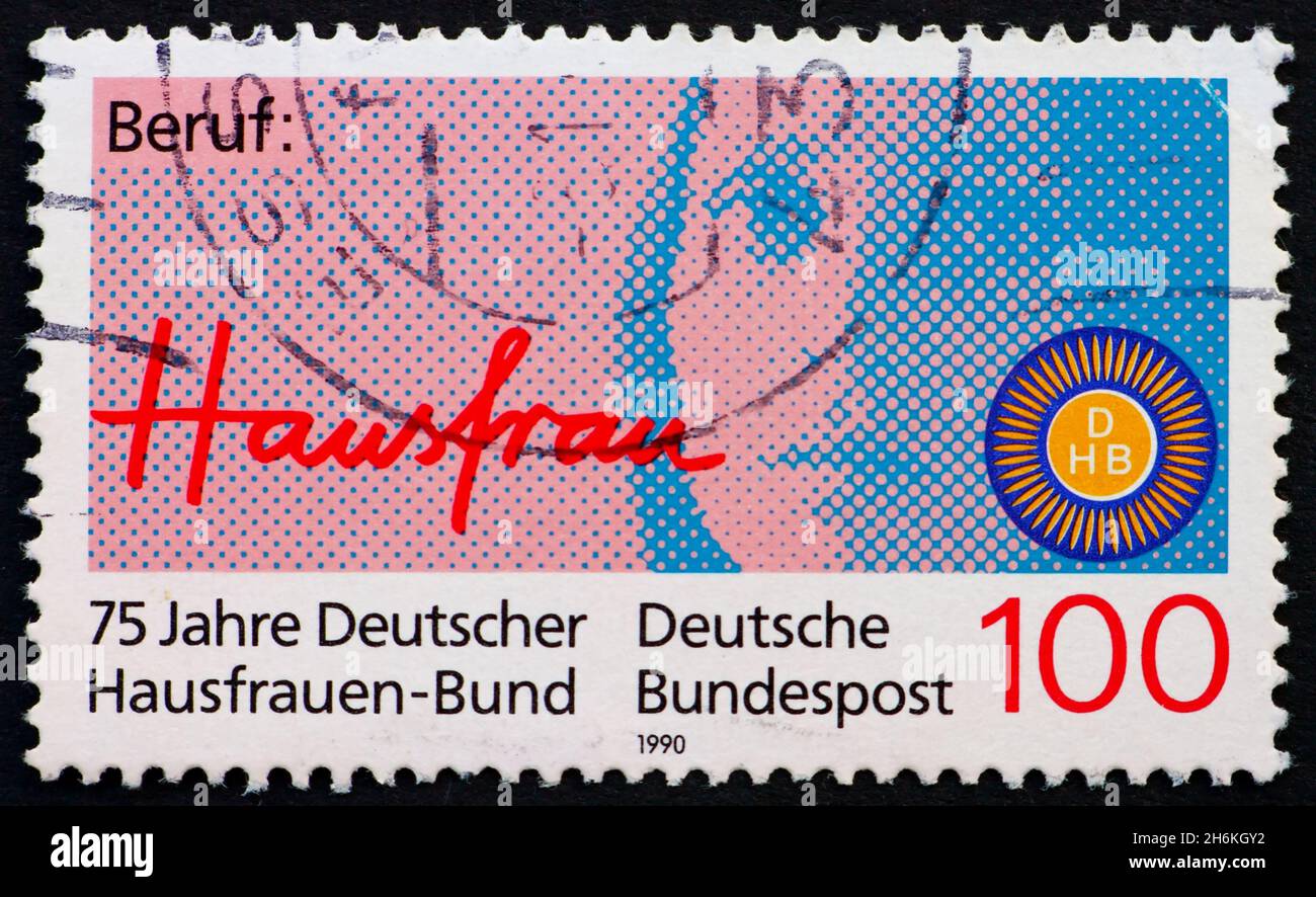 GERMANY - CIRCA 1990: a stamp printed in the Germany shows Woman, 75th ...