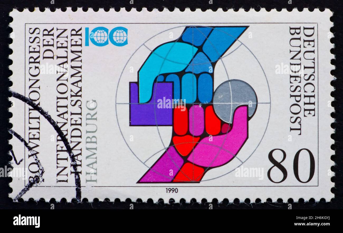 GERMANY - CIRCA 1990: a stamp printed in the Germany shows Two Arms ...