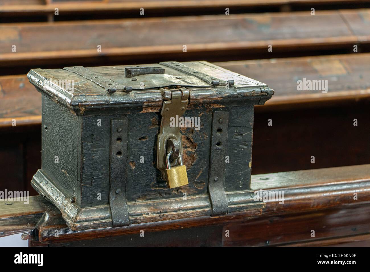 The church money box mounted on a pew in the church Stock Photo - Alamy