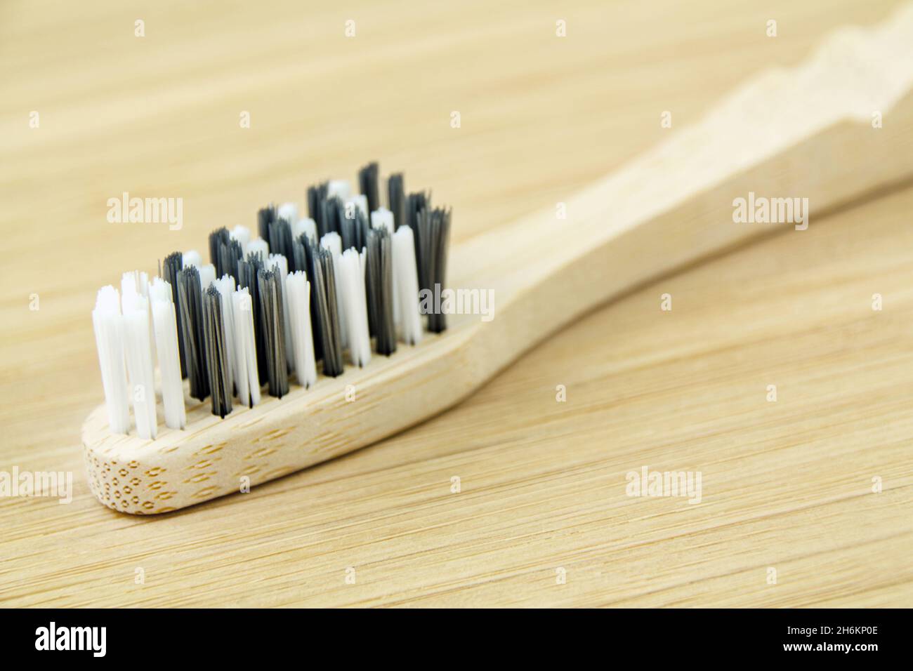 Bamboo toothbrush on wooden bamboo board Stock Photo - Alamy