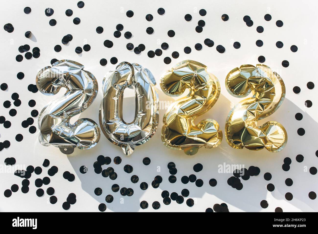 Balloons made of gold and silver foil in the form of numbers 2022 with ...