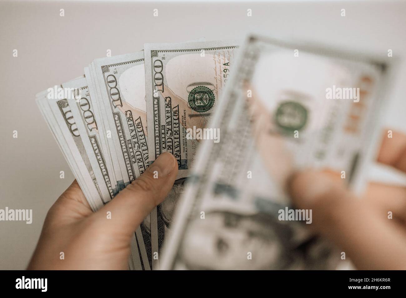 Close up of hands counting money American dollars. Income and business ...