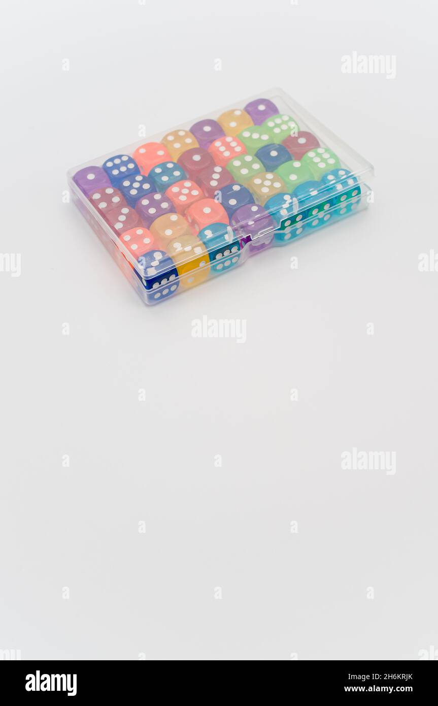 box of multicolored dice on a white background with text space Stock ...