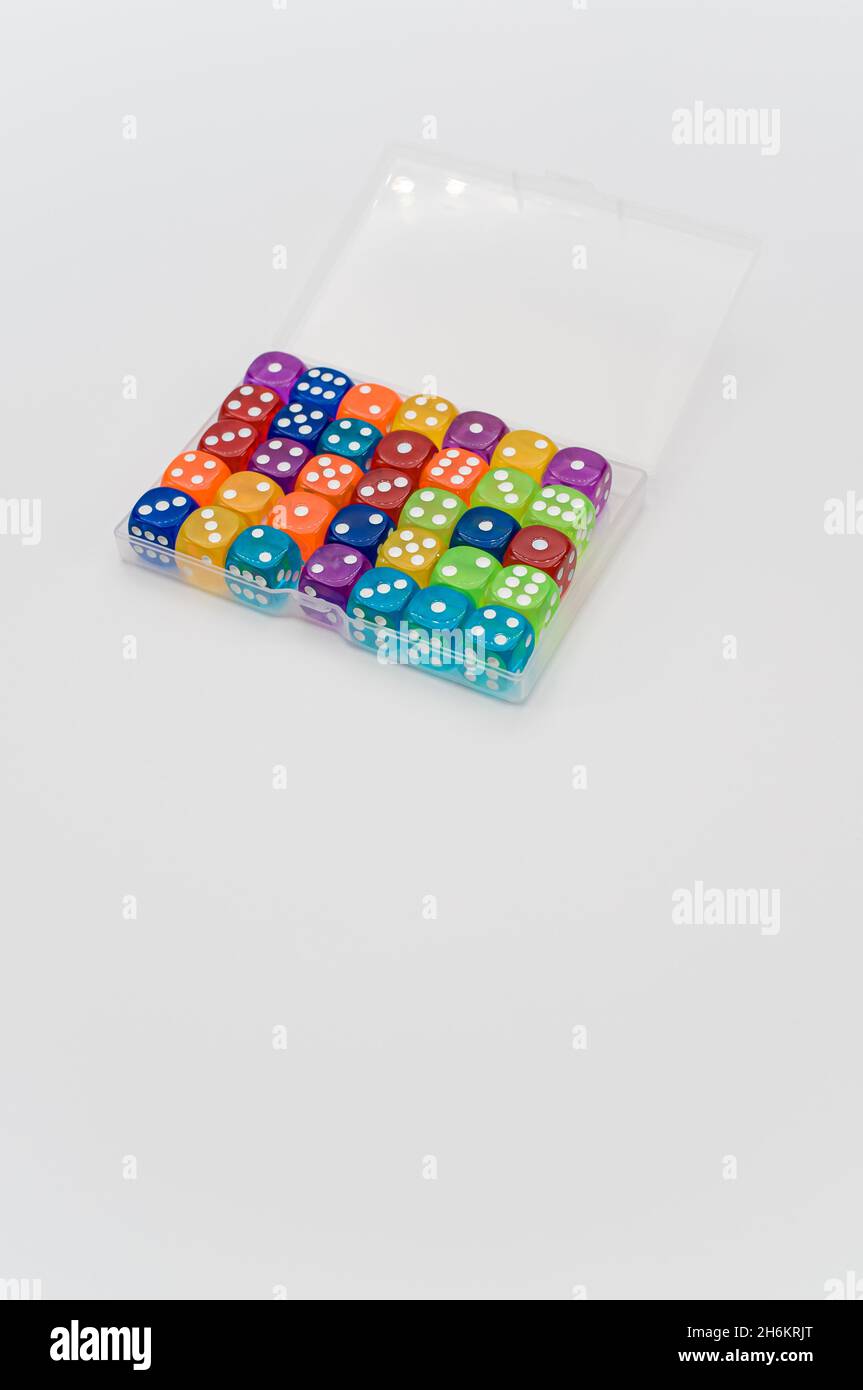 box of multicolored dice on a white background with text space Stock ...