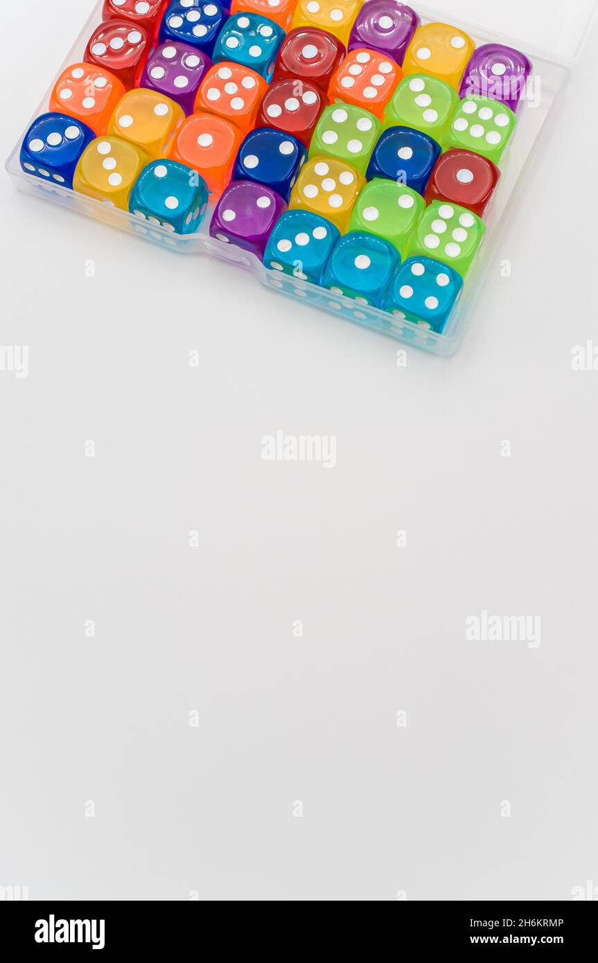 box of multicolored dice on a white background with text space Stock ...