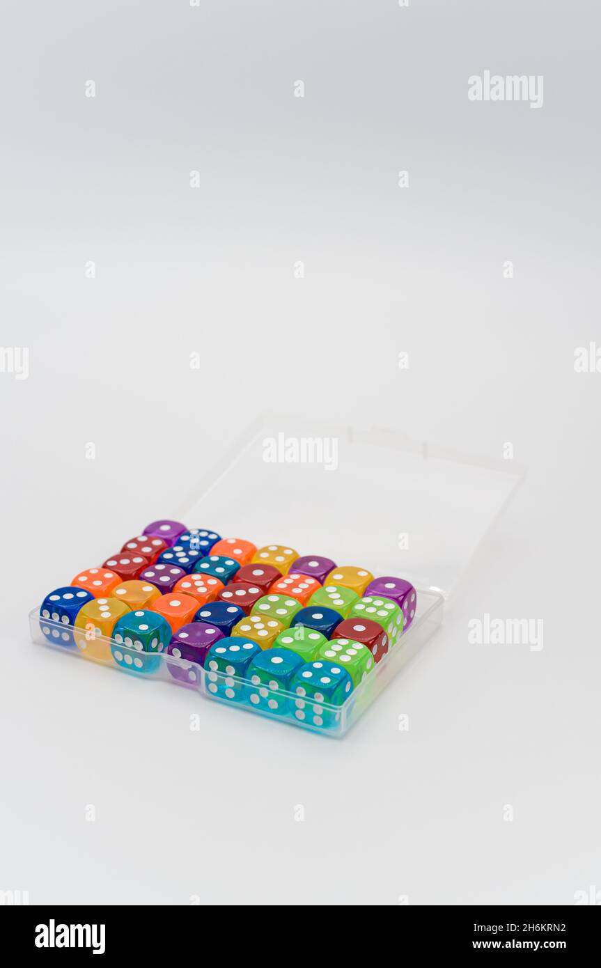 box of multicolored dice on a white background with text space Stock ...
