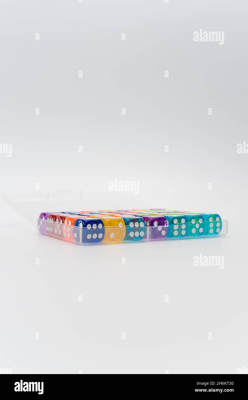 box of multicolored dice on a white background with text space Stock ...