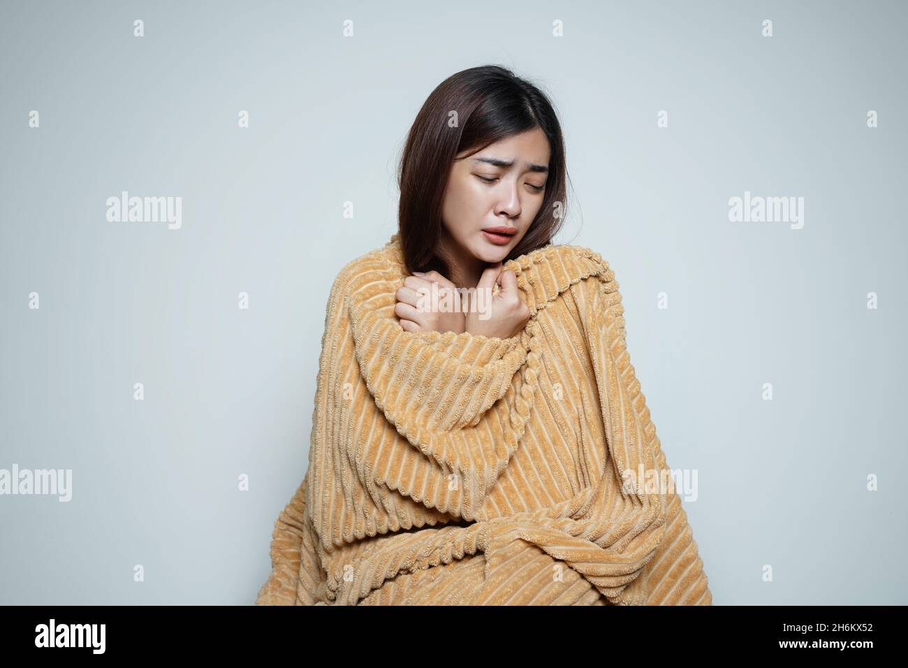 beautiful woman wearing scarf and blanket to warm her cold body Stock ...