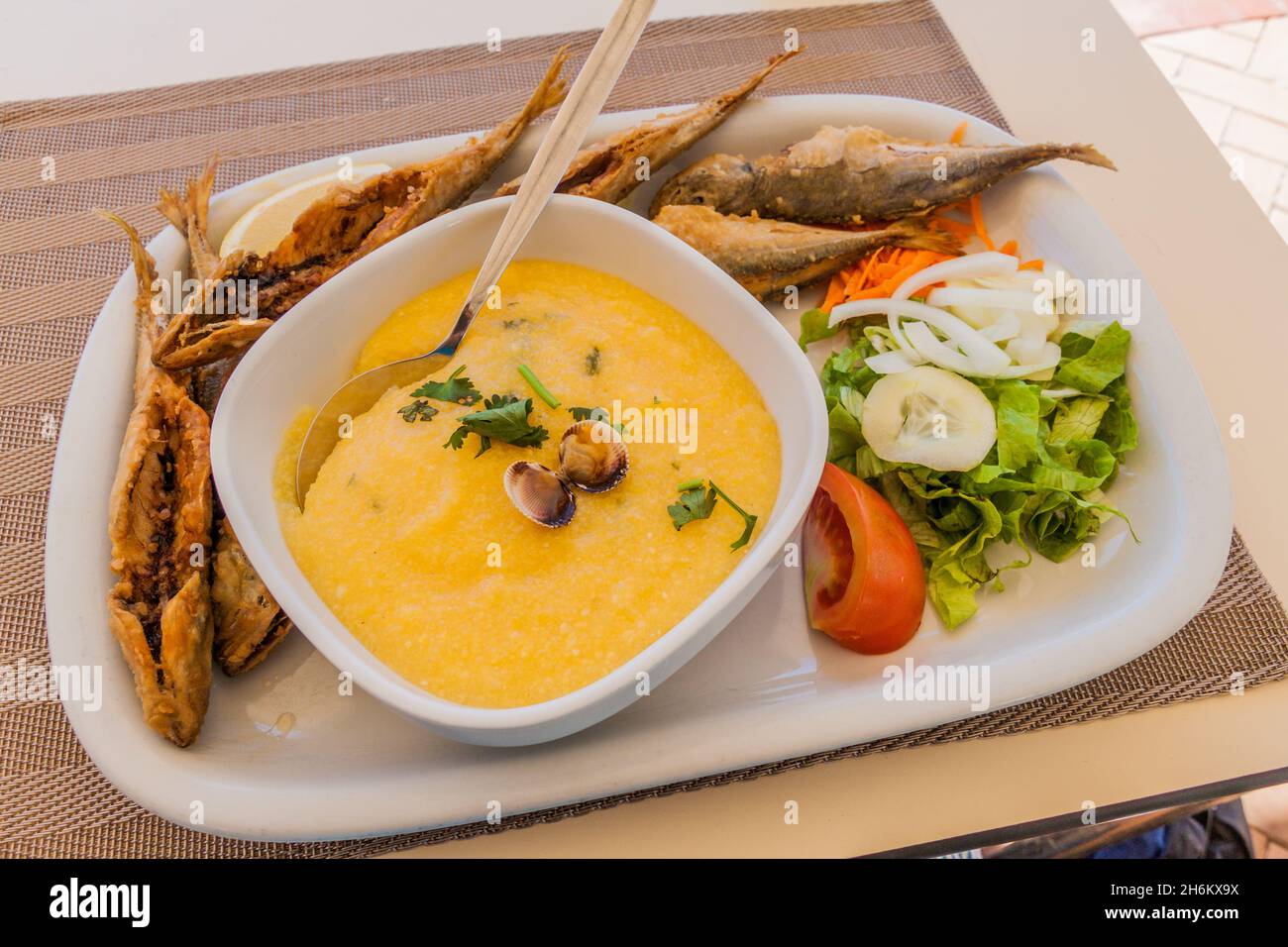 Food in Faro, Portugal. Xarem mash made of corn flour with clams with ...
