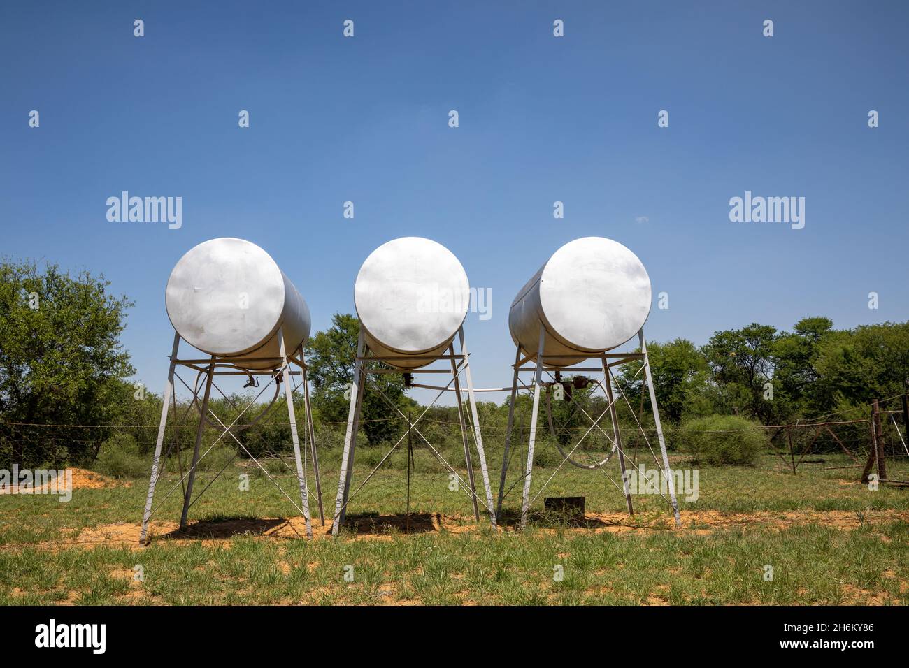 Three large silver painted metal fuel containers on a farm Stock Photo ...