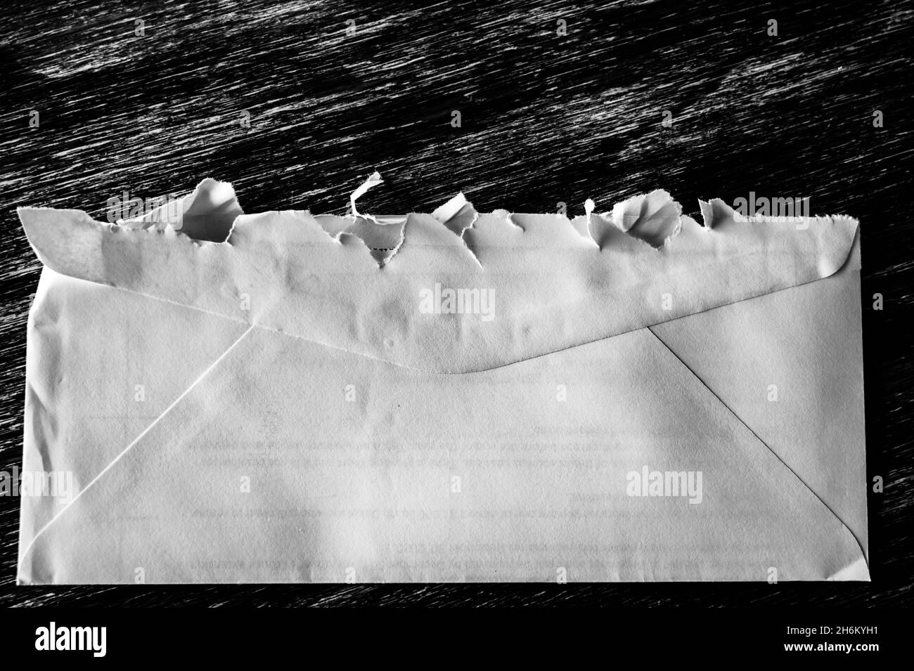 Selective focus on jagged edges of a ripped open mail envelope Stock ...