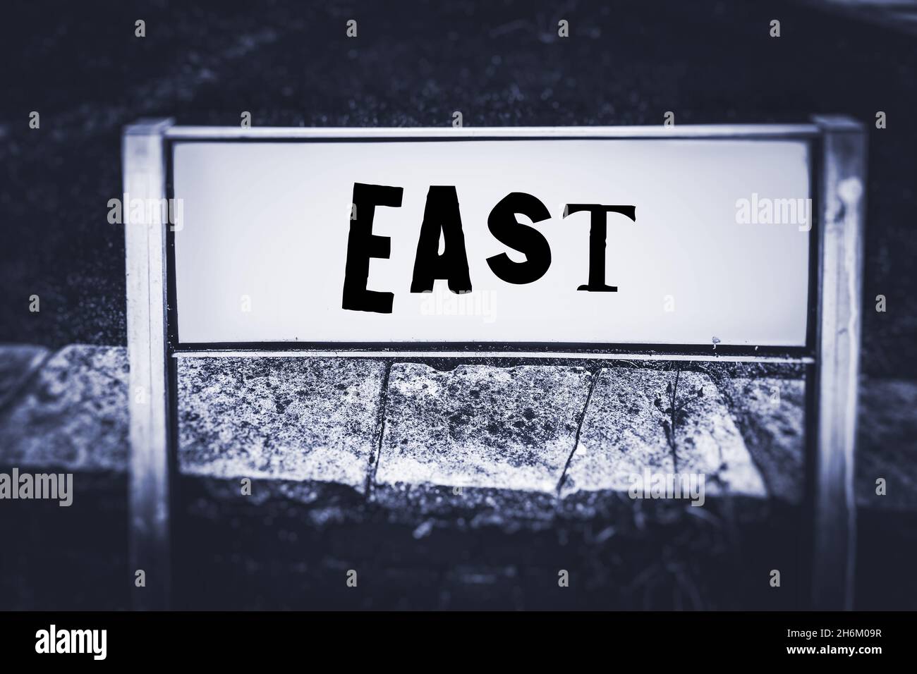 Street corner road signage displaying the word East in a display ...