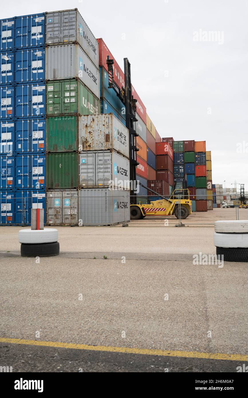 Shipping containers stacked in a holding zone Stock Photo - Alamy