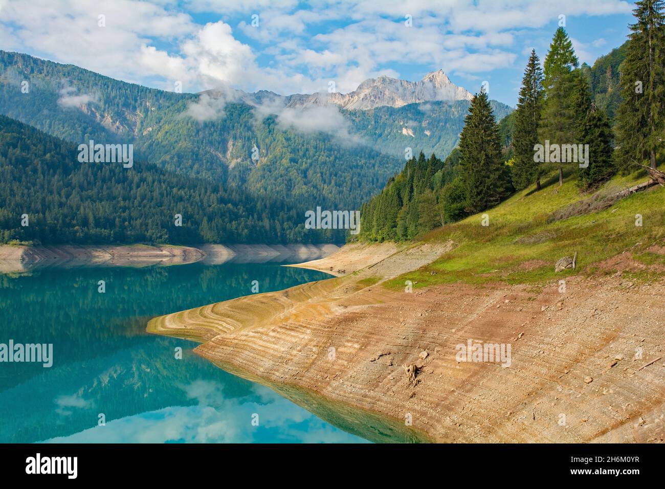 Low water in Sauris Lake, Lago di Sauris, late September. The lake is ...