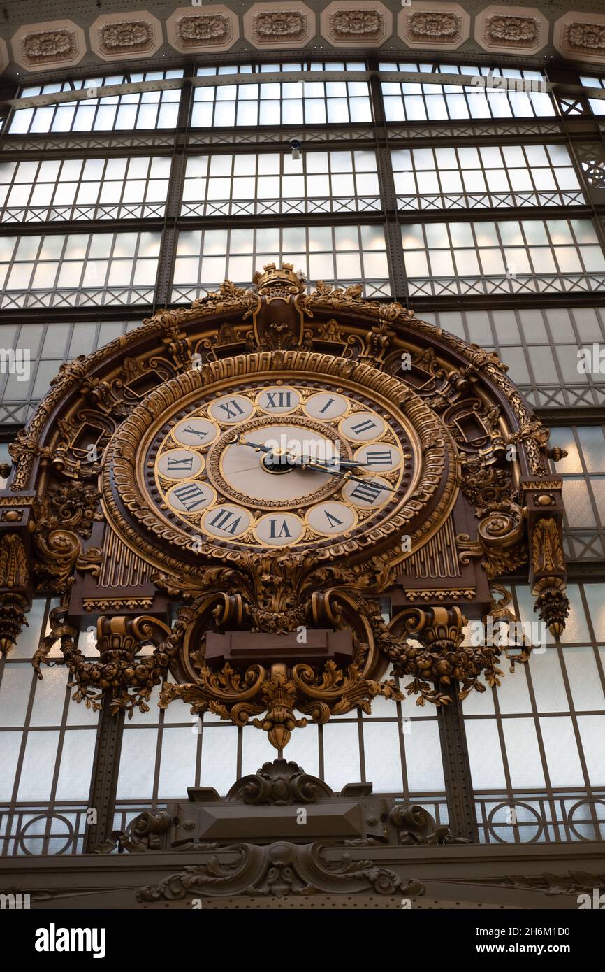 Low angle of the big golden ornamental clock in the Orsay Museum in ...