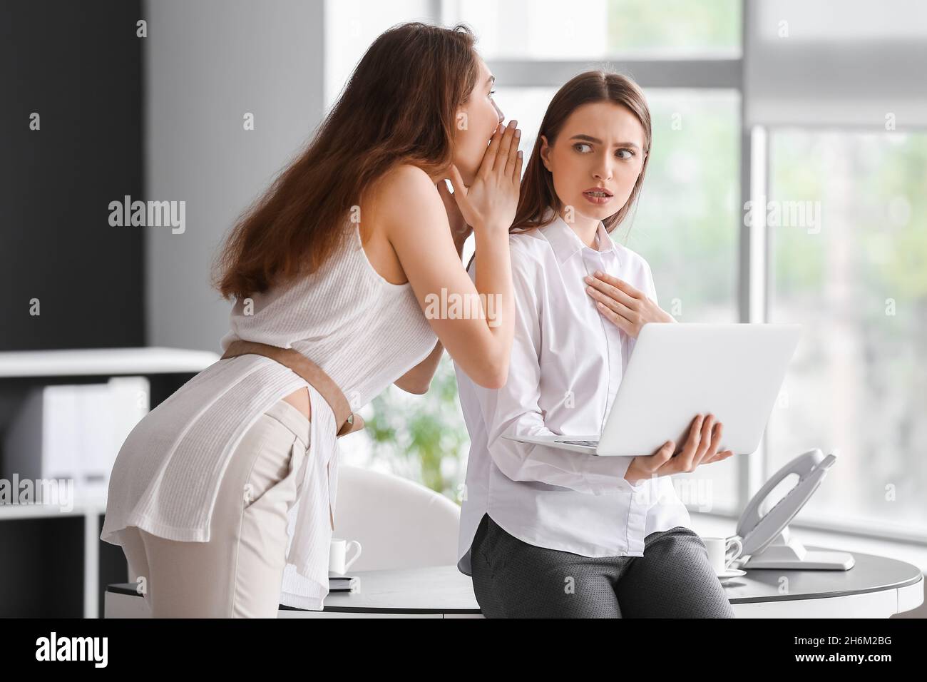 Gossiping in office hi-res stock photography and images - Alamy