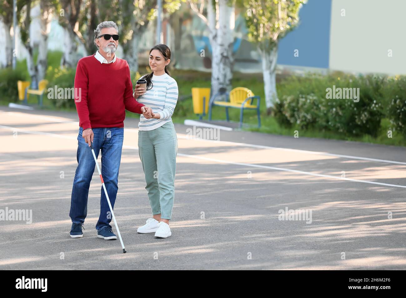 Blind senior man with his daughter walking outdoors Stock Photo - Alamy