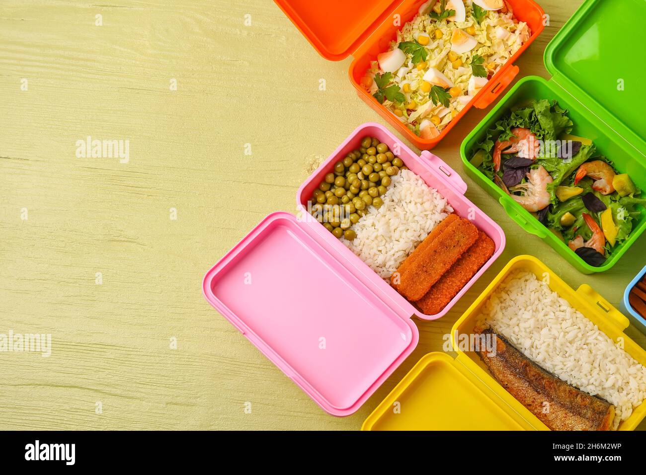 Many containers with healthy food on color wooden background Stock ...