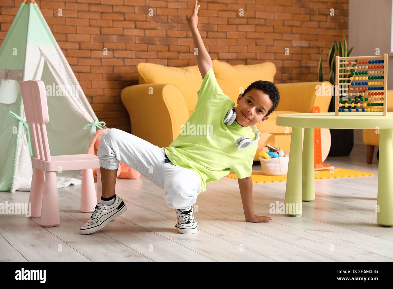 Dancing African-American boy at home Stock Photo - Alamy